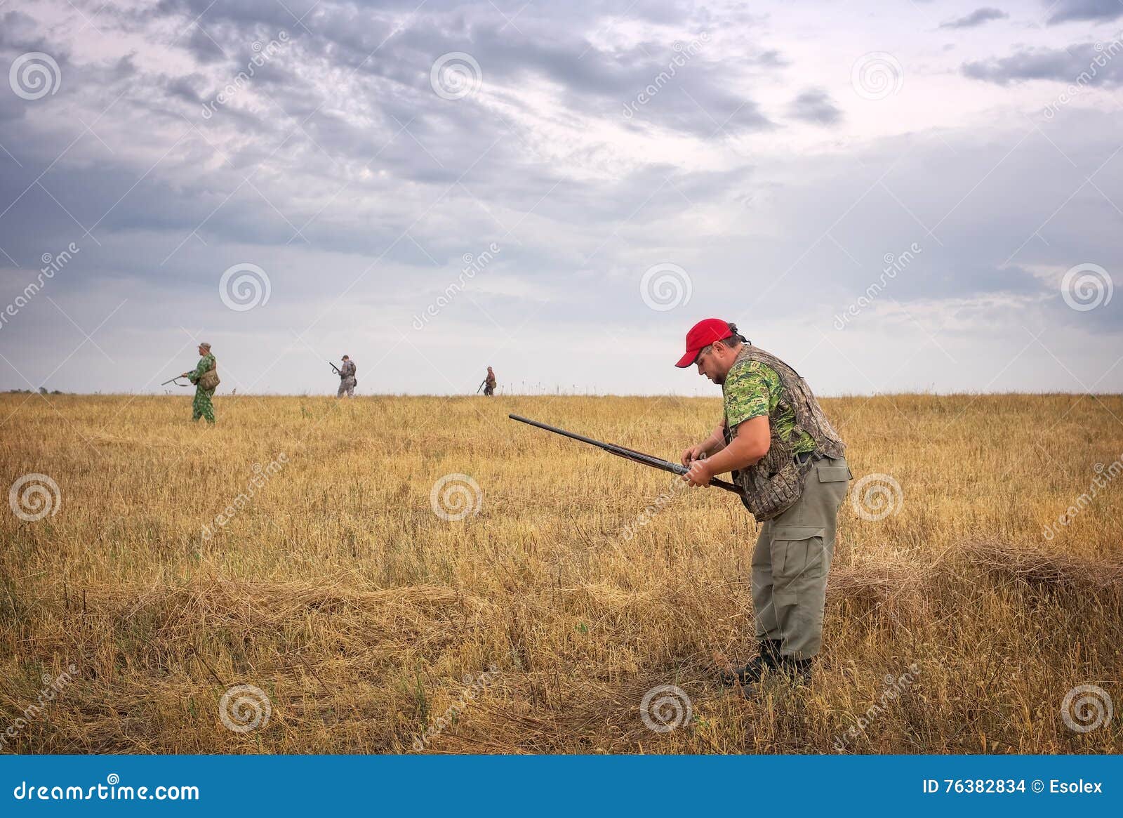 One Hunter Charges Ammo and Other Hunters Moving Stock Photo - Image of ...