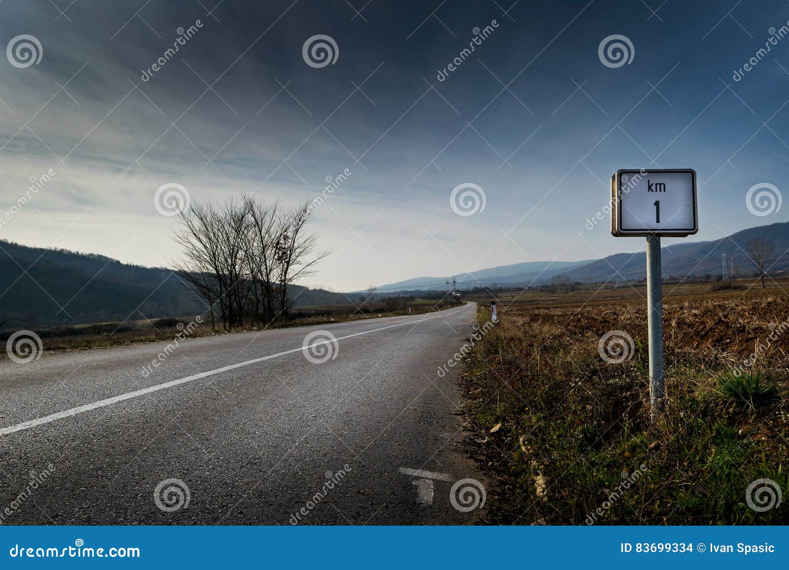 One Kilometer Sign on the Road Stock Photo - Image of cloudy ...