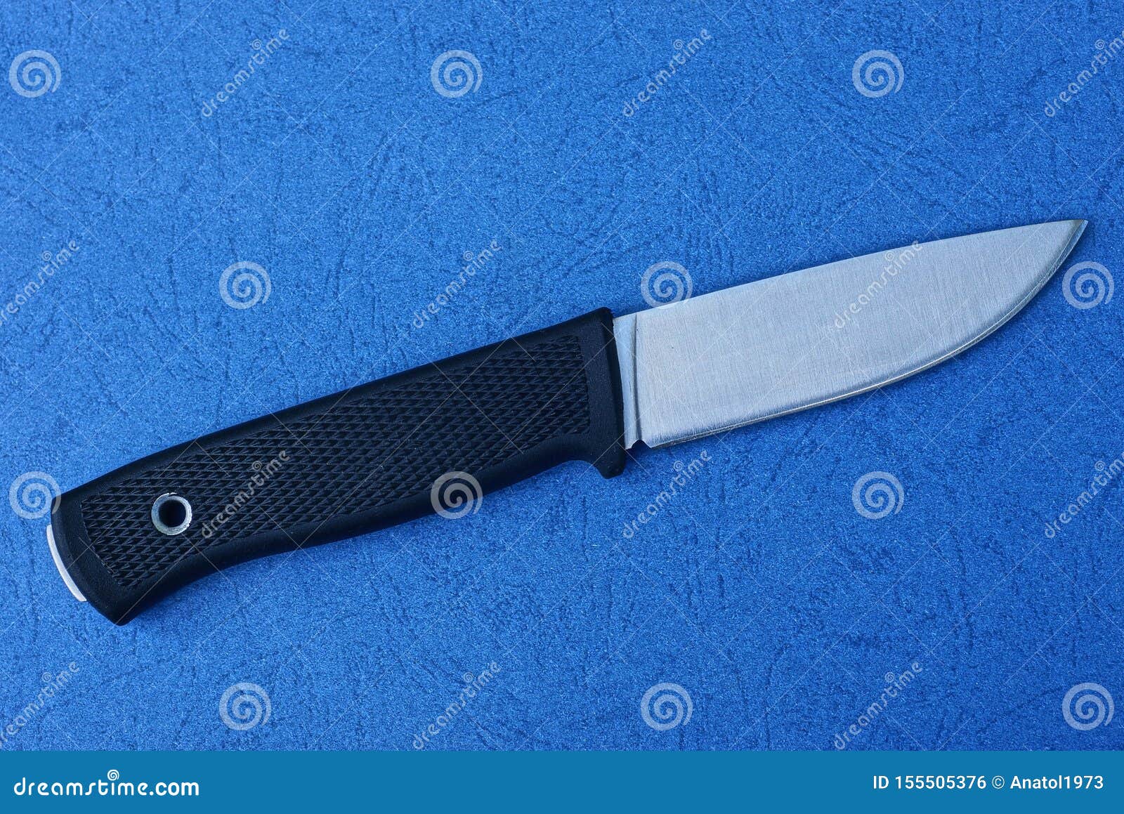 Knife with a Black Handle Lies on a Blue Table Stock Photo - Image of ...