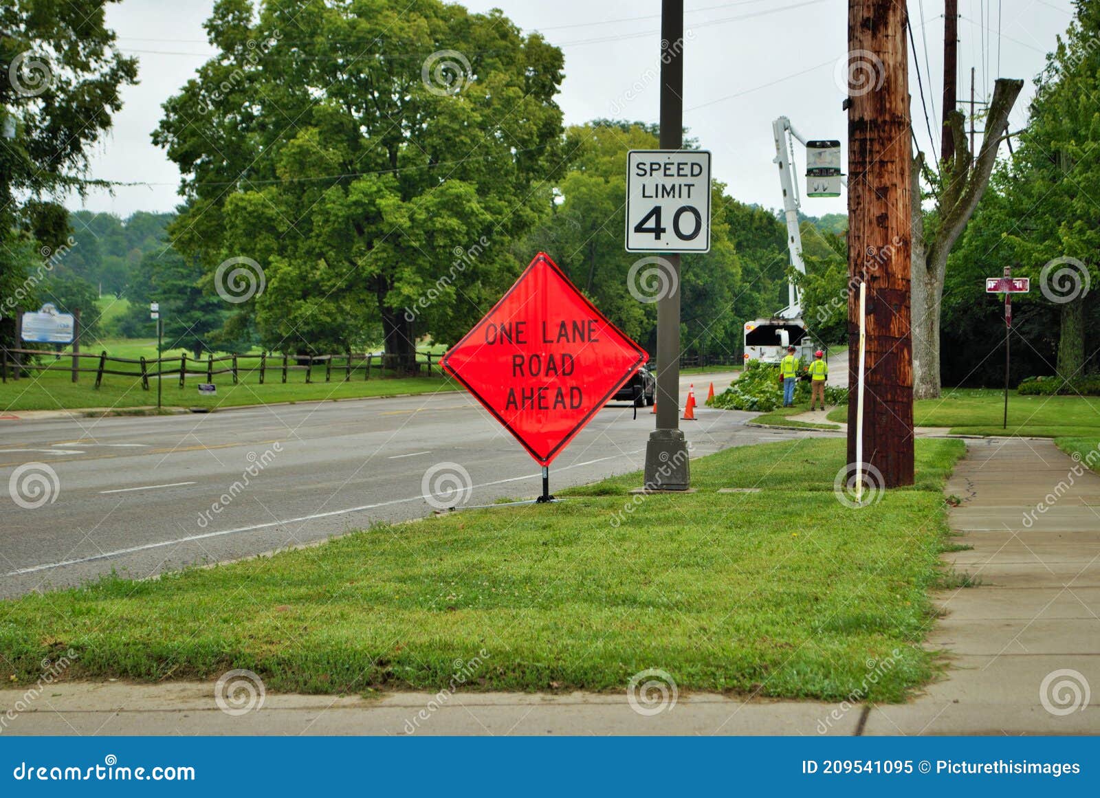 One Lane Road Ahead Construction Sign on the Side of a Five Lane Road ...