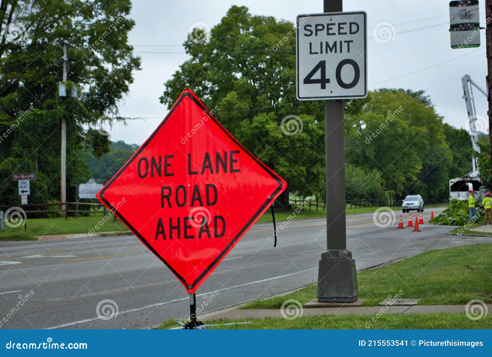 One Lane Road Ahead Construction Sign on the Side of a Five Lane Road ...