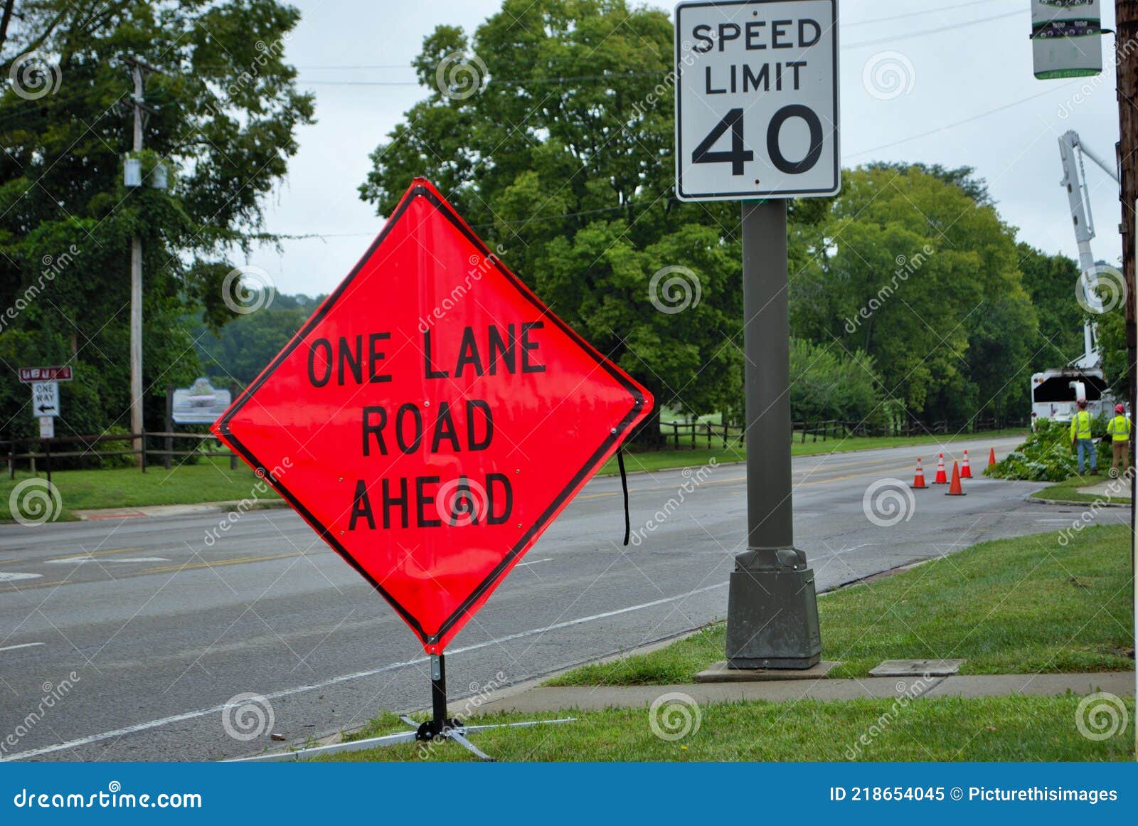 One Lane Road Ahead Construction Sign on the Side of a Five Lane Road ...