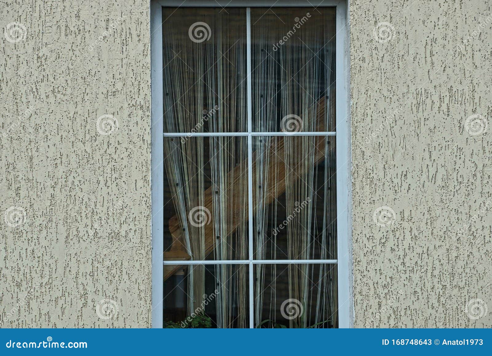 One Large Rectangular Window with a White Frame on the Gray Plastered ...