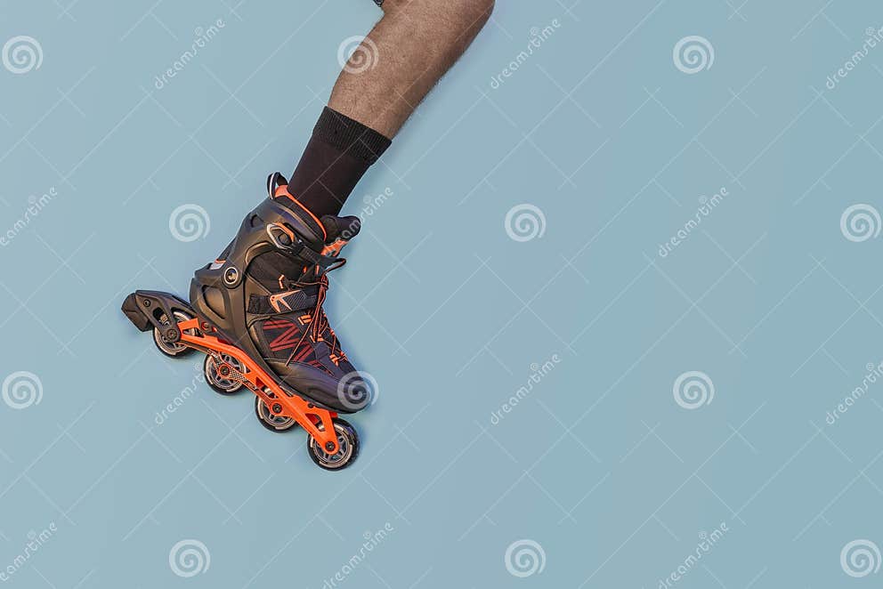 One Leg of Boy with Inline Skate on Blue Background Stock Photo - Image ...