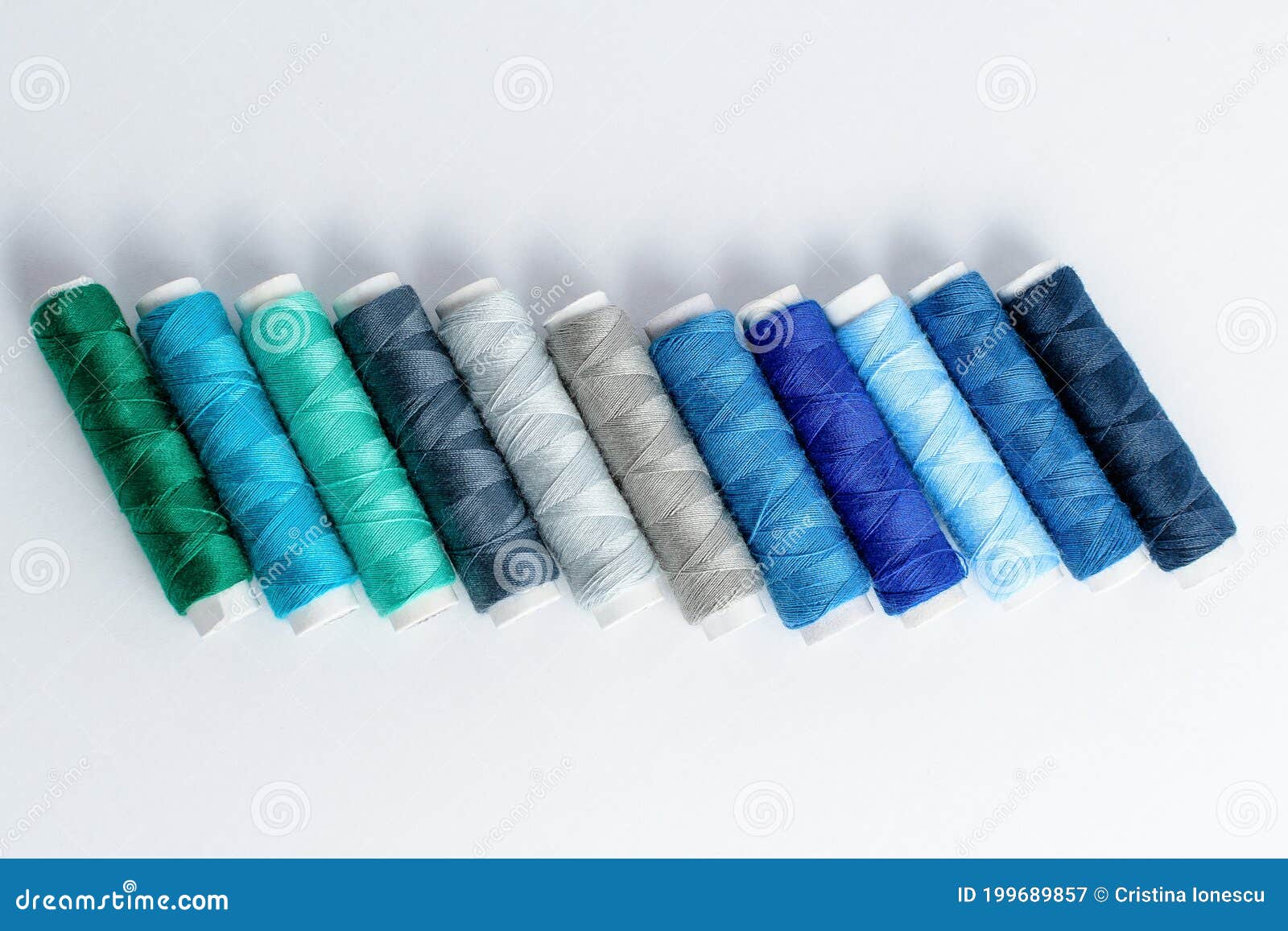 One Line of Mixed Colourful Blue Spools of Cotton Thread Displayed ...