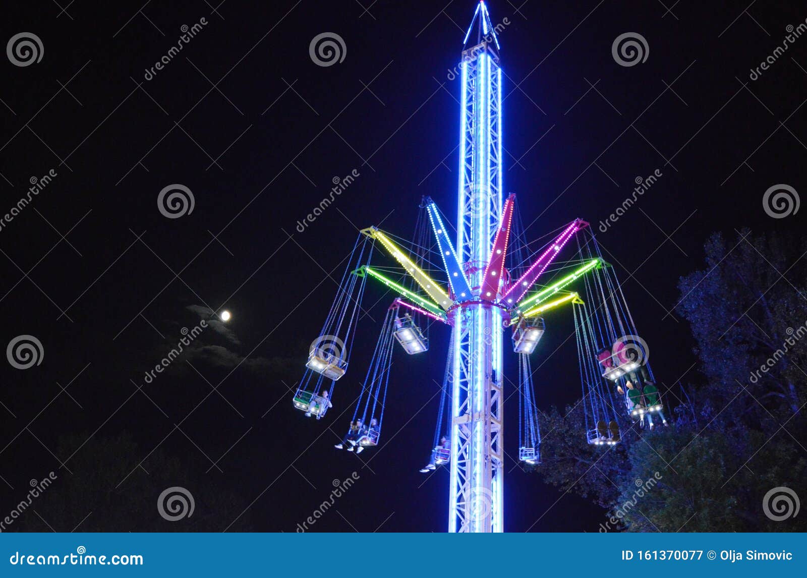 Lit slide at night stock image. Image of dark, color - 161370077