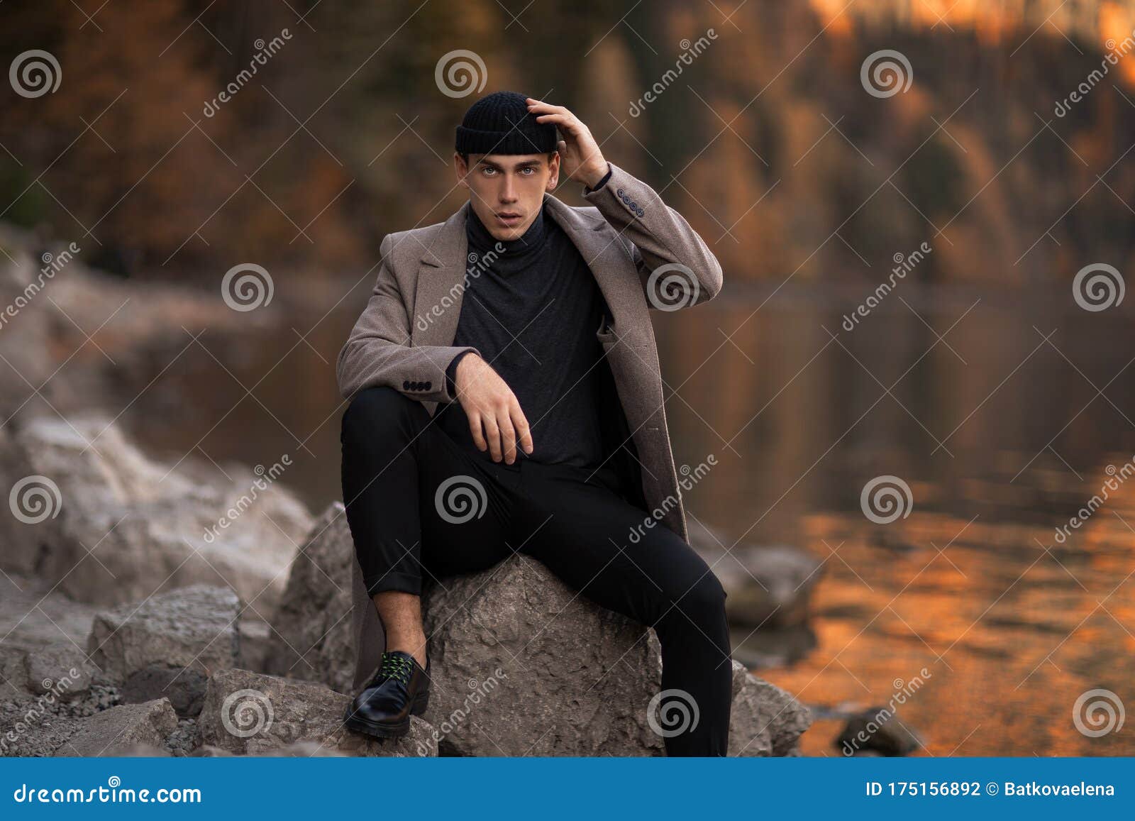 One Male Model Dressed with a Stylish Coat and a Fall Cap Outside Stock ...
