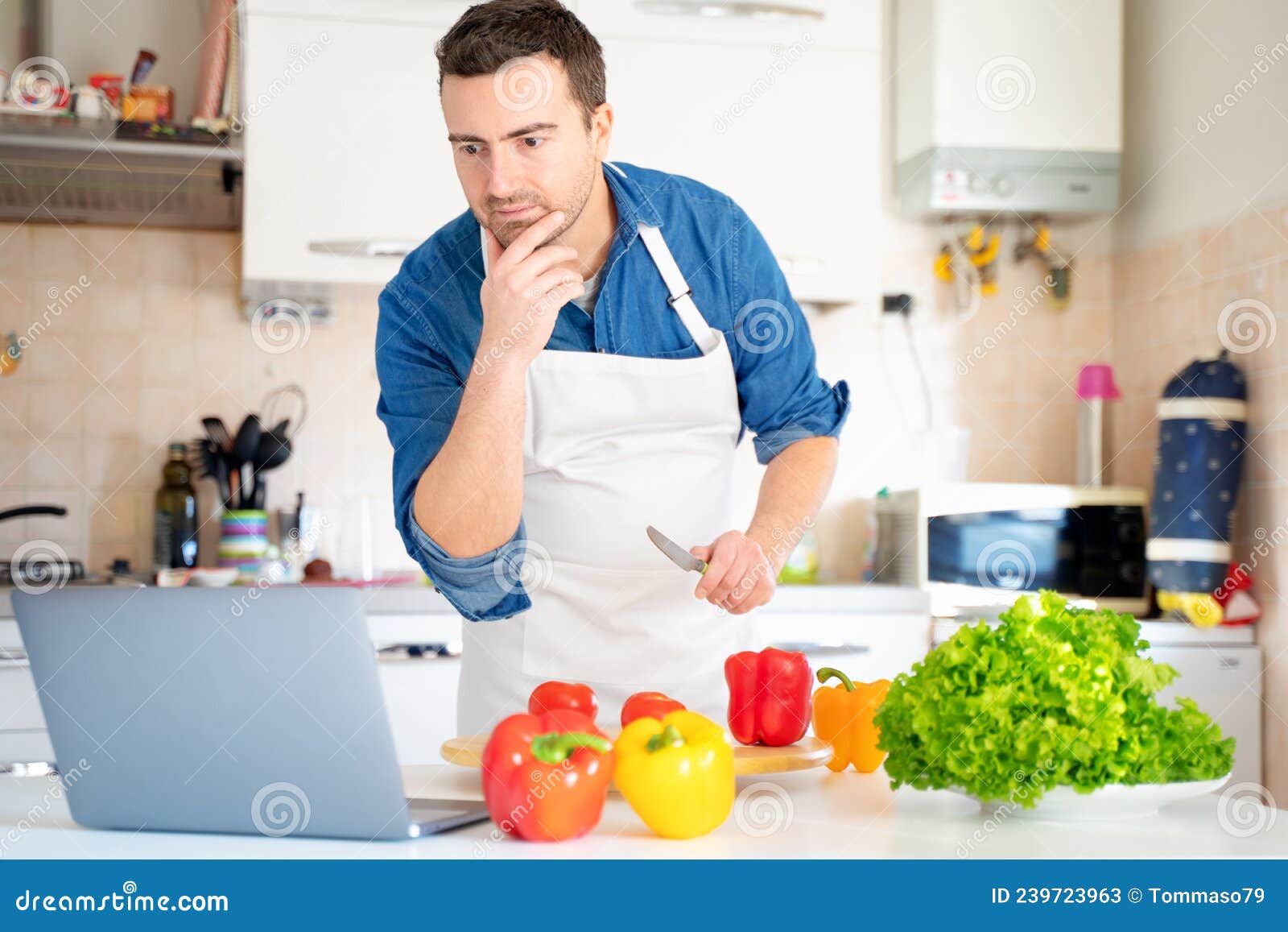 One Man is Learning To Cook Watching Video Online Stock Image - Image ...