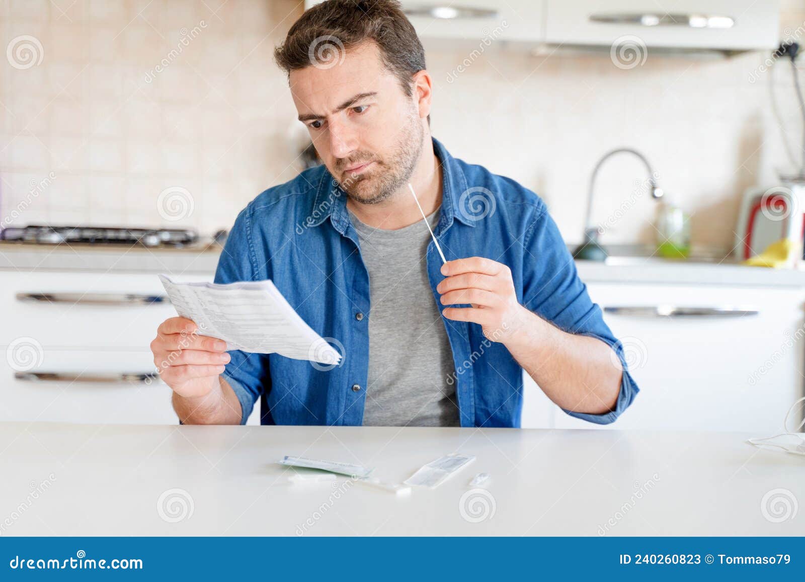 One Man Reading Instructions about Rapid Test Device for COVID-19 Stock ...