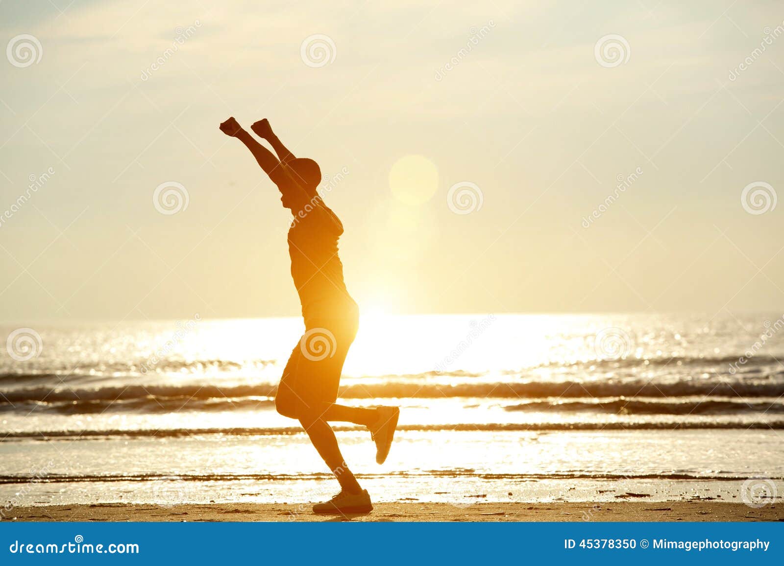 One Man Running on Beach with Arms Raised Stock Photo - Image of action ...