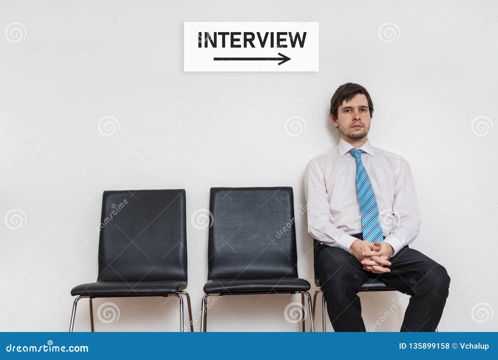 One Man is Sitting on Chair in Waiting Room and Waiting for Interview ...
