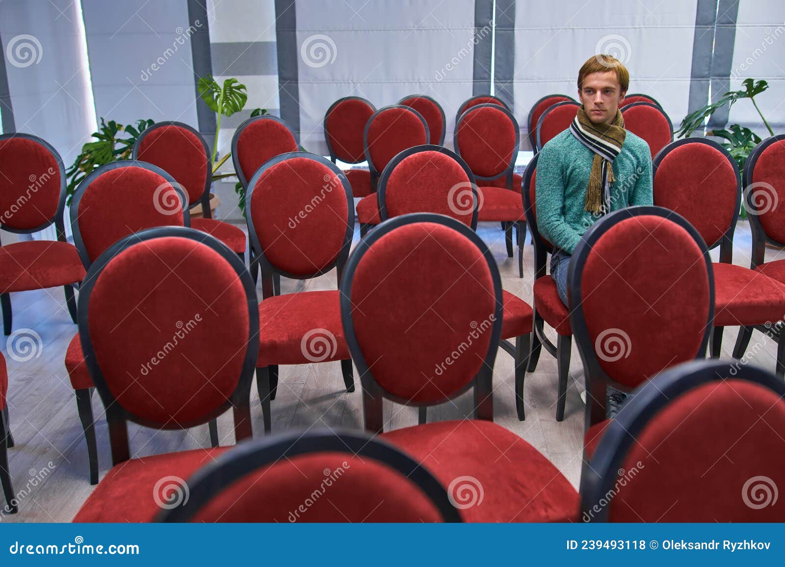 One Man Sitting in Empty Theater Auditorium Stock Photo - Image of ...