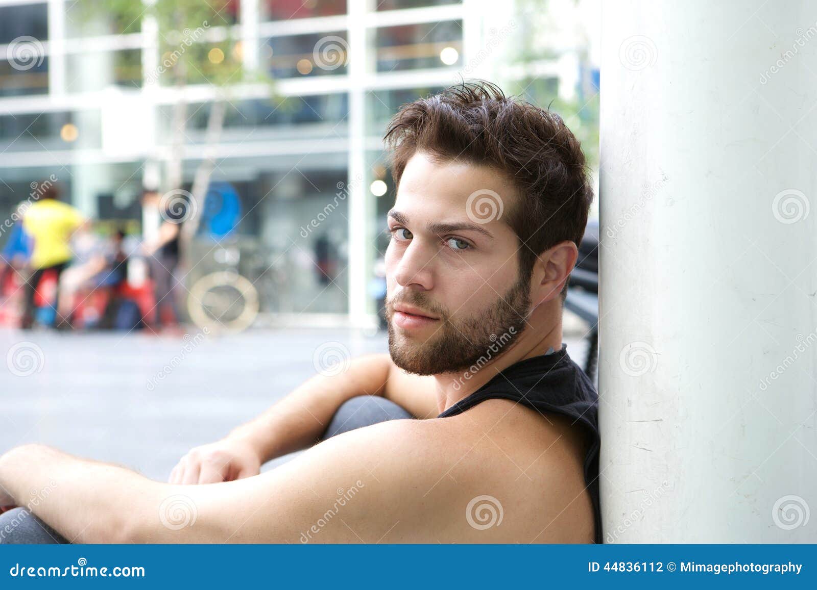 One man sitting outdoors stock photo. Image of modern - 44836112