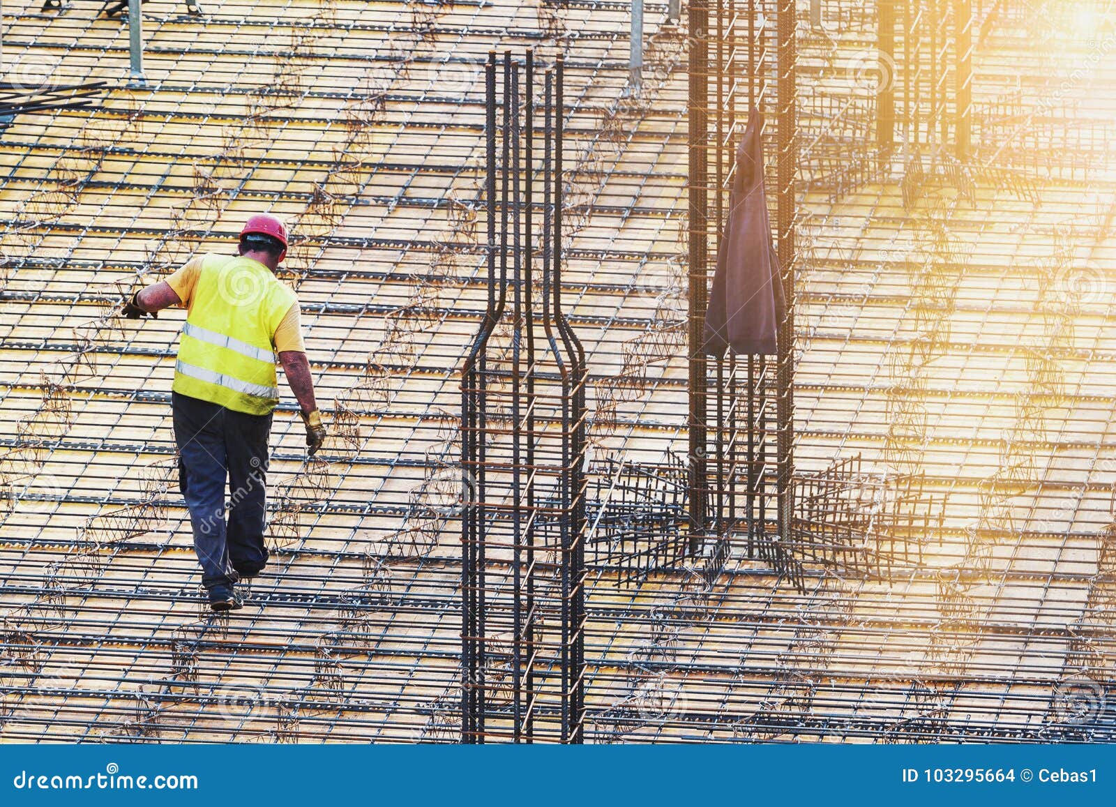 Worker Doing The Steelwork For Reinforcement Of The Concrete Structure ...