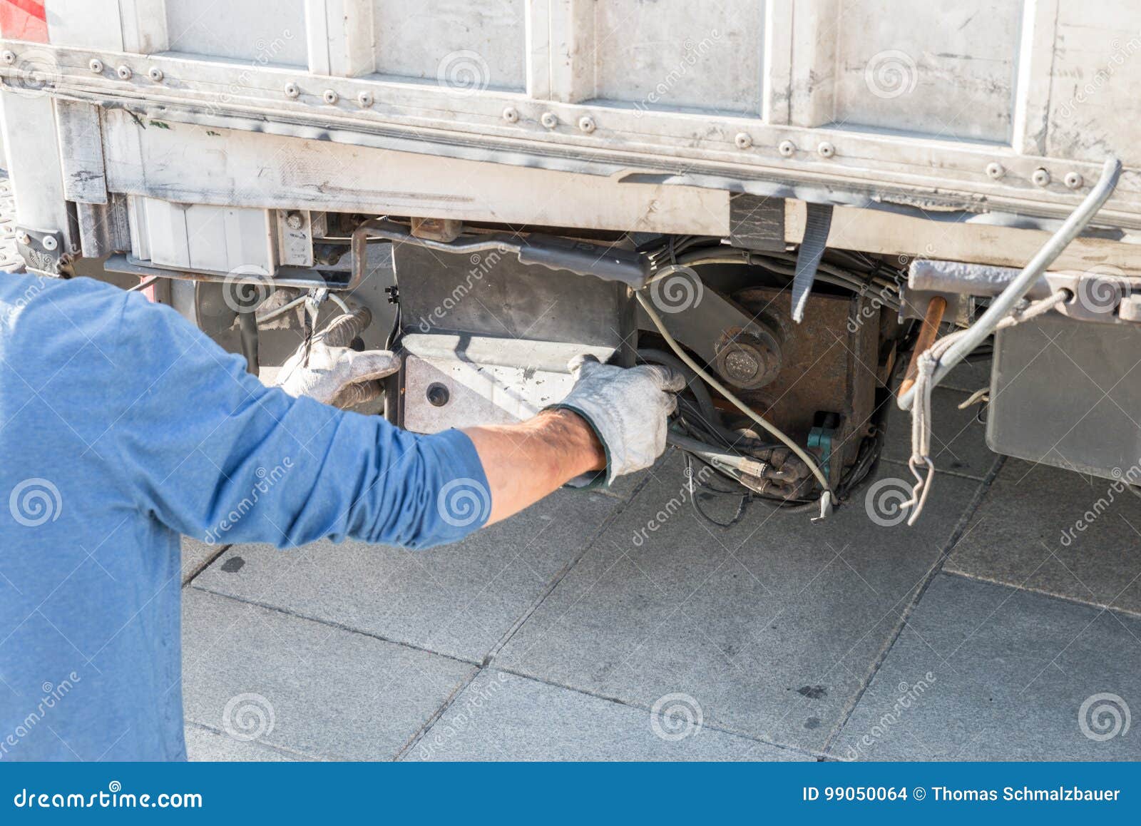 One Mechanic is Operating a Loading Ramp of a Truck Stock Photo - Image ...