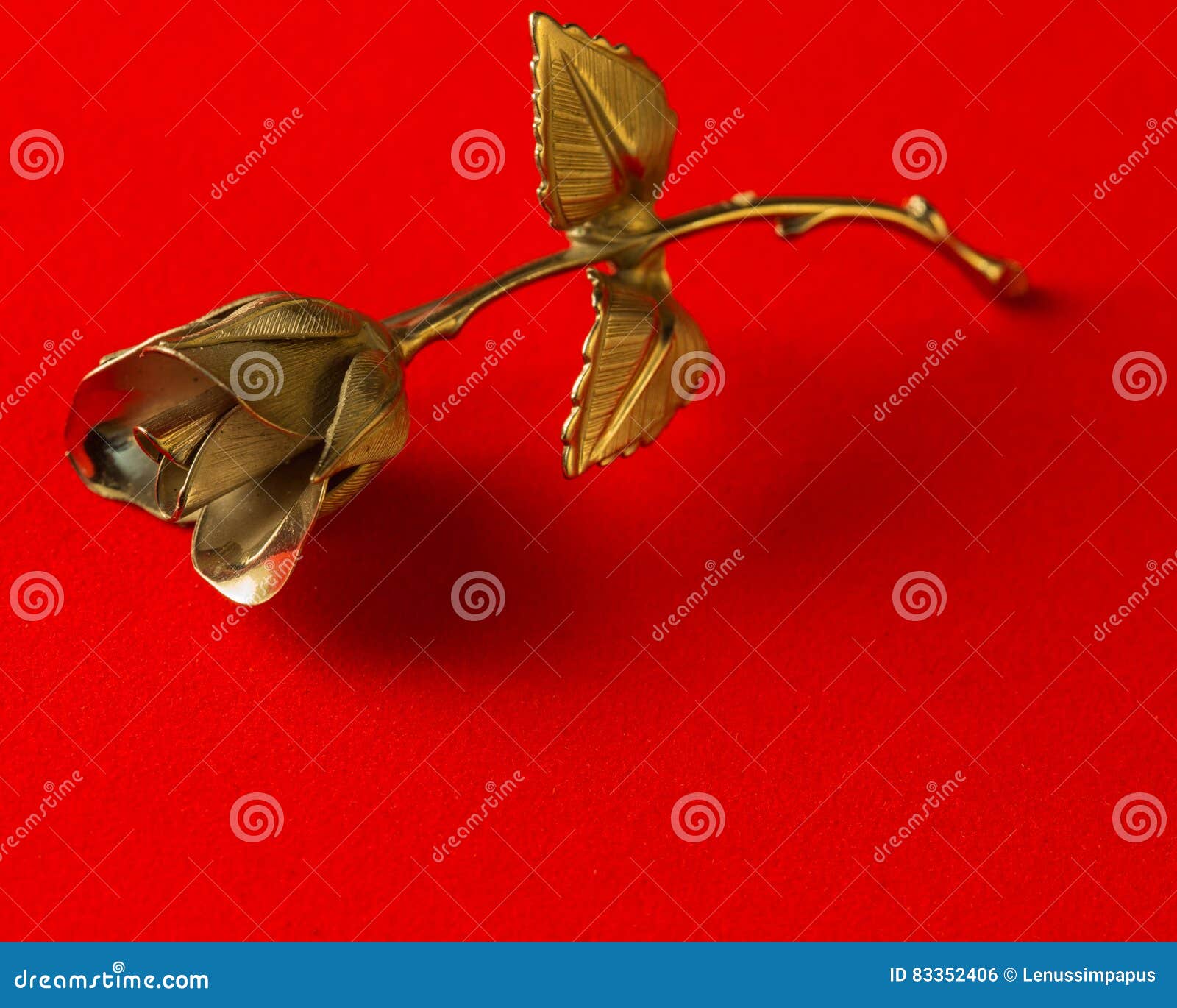 One Metal Rose on a Red Background for Holiday Greetings Stock Photo ...
