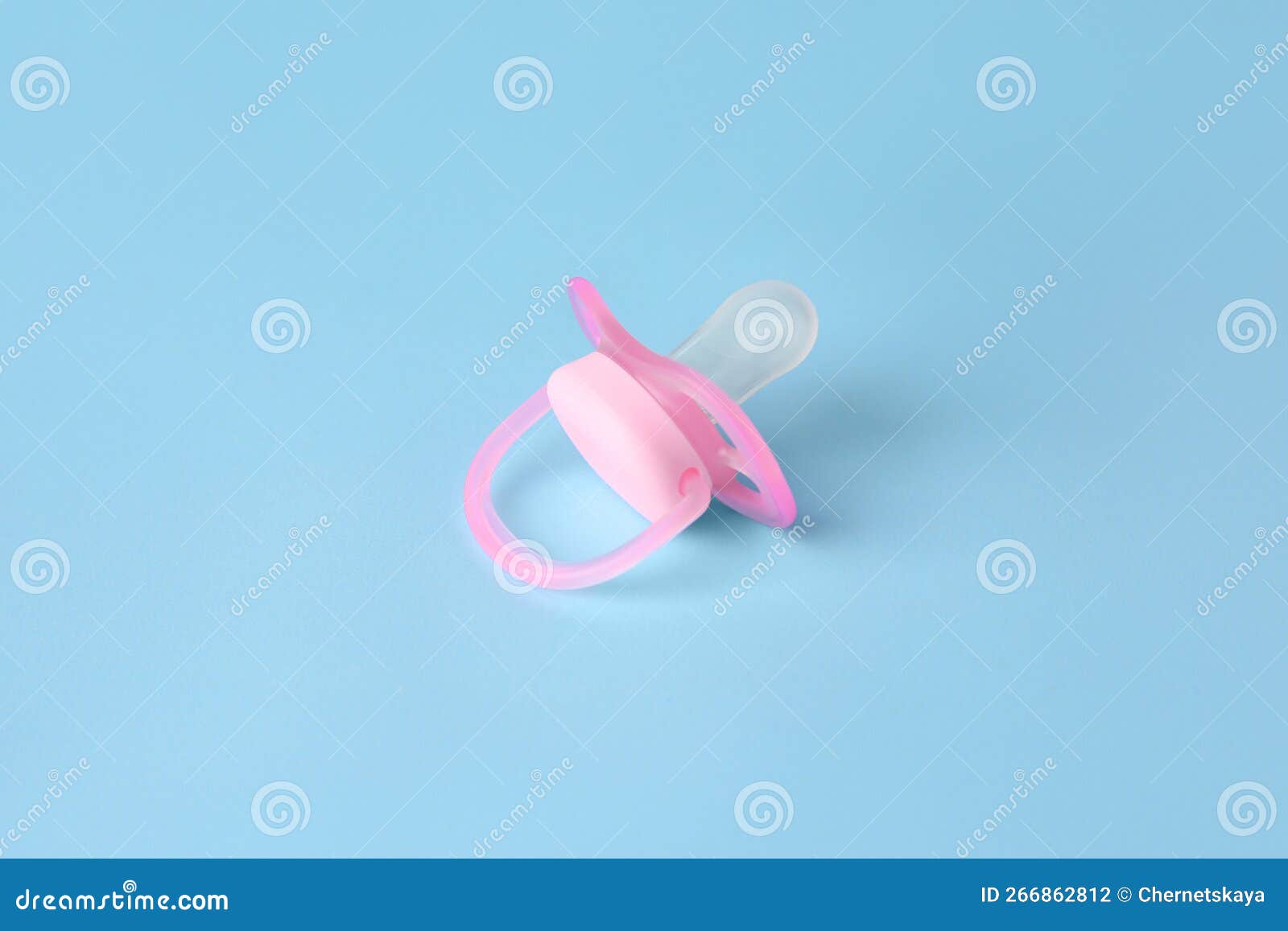 One New Baby Pacifier on Light Blue Background Stock Photo - Image of ...