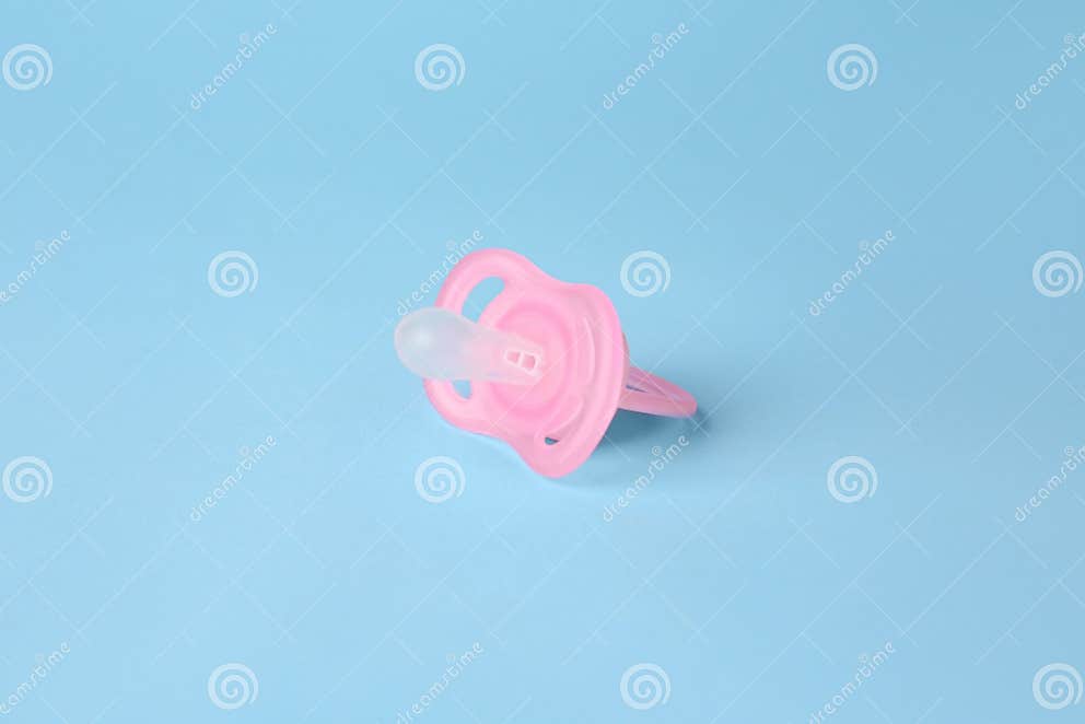 One New Baby Pacifier on Light Blue Background Stock Photo - Image of ...
