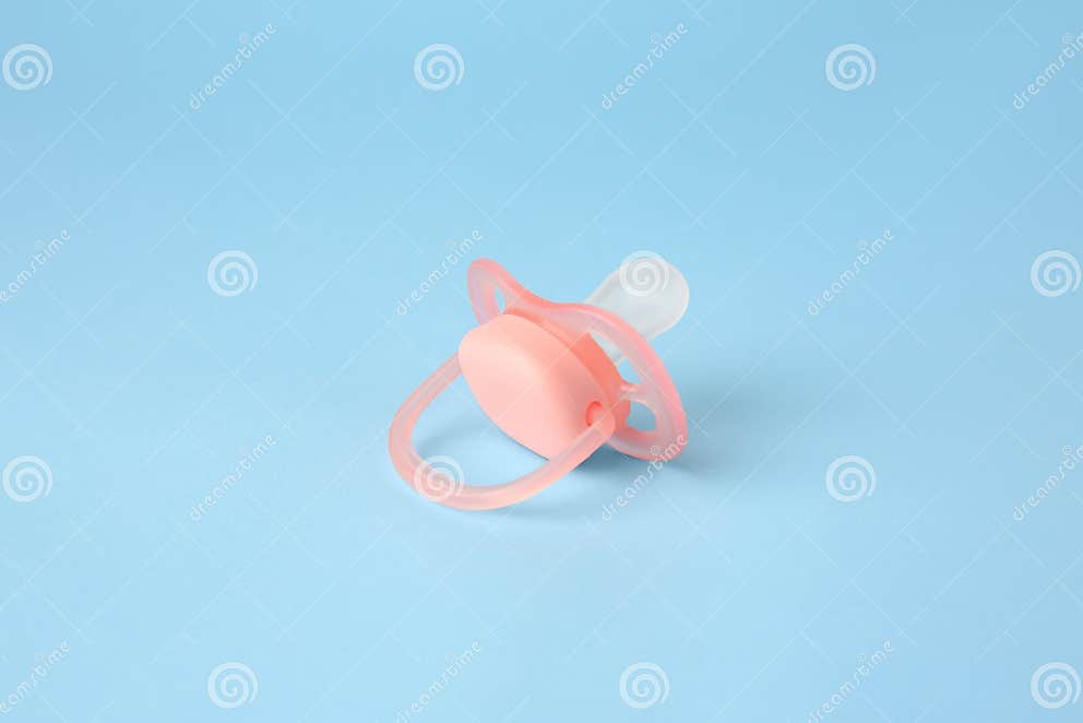 One New Baby Pacifier on Light Blue Background Stock Image - Image of ...