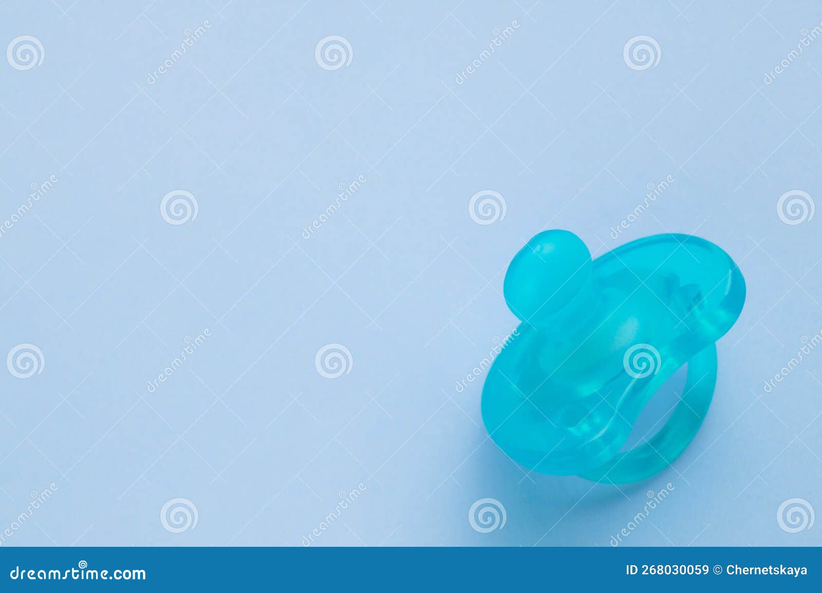 One New Baby Pacifier on Light Blue Background, Top View. Space for ...