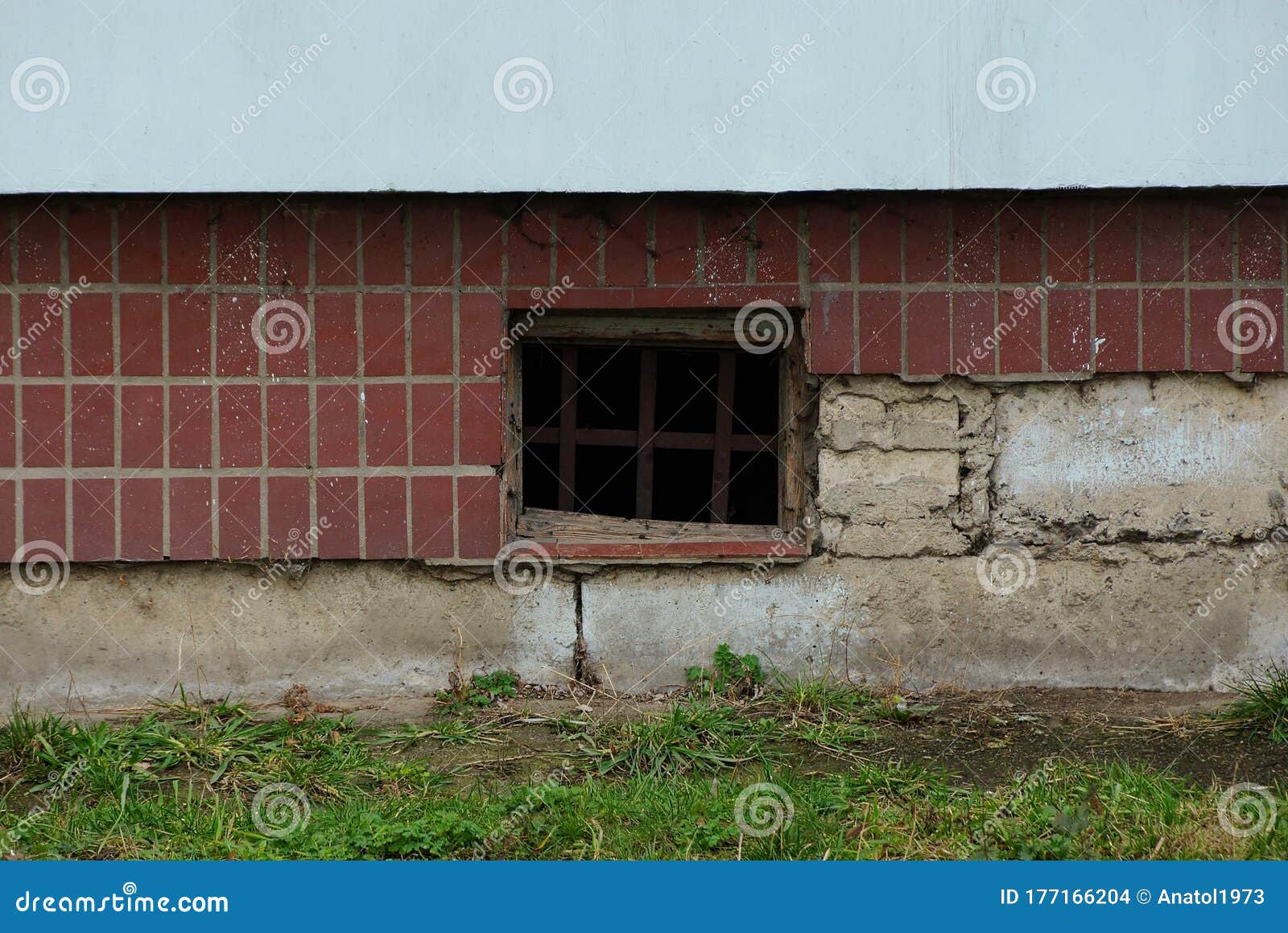 One Old Basement Window with a Rusty Bars on the Brown Wall Stock Photo ...