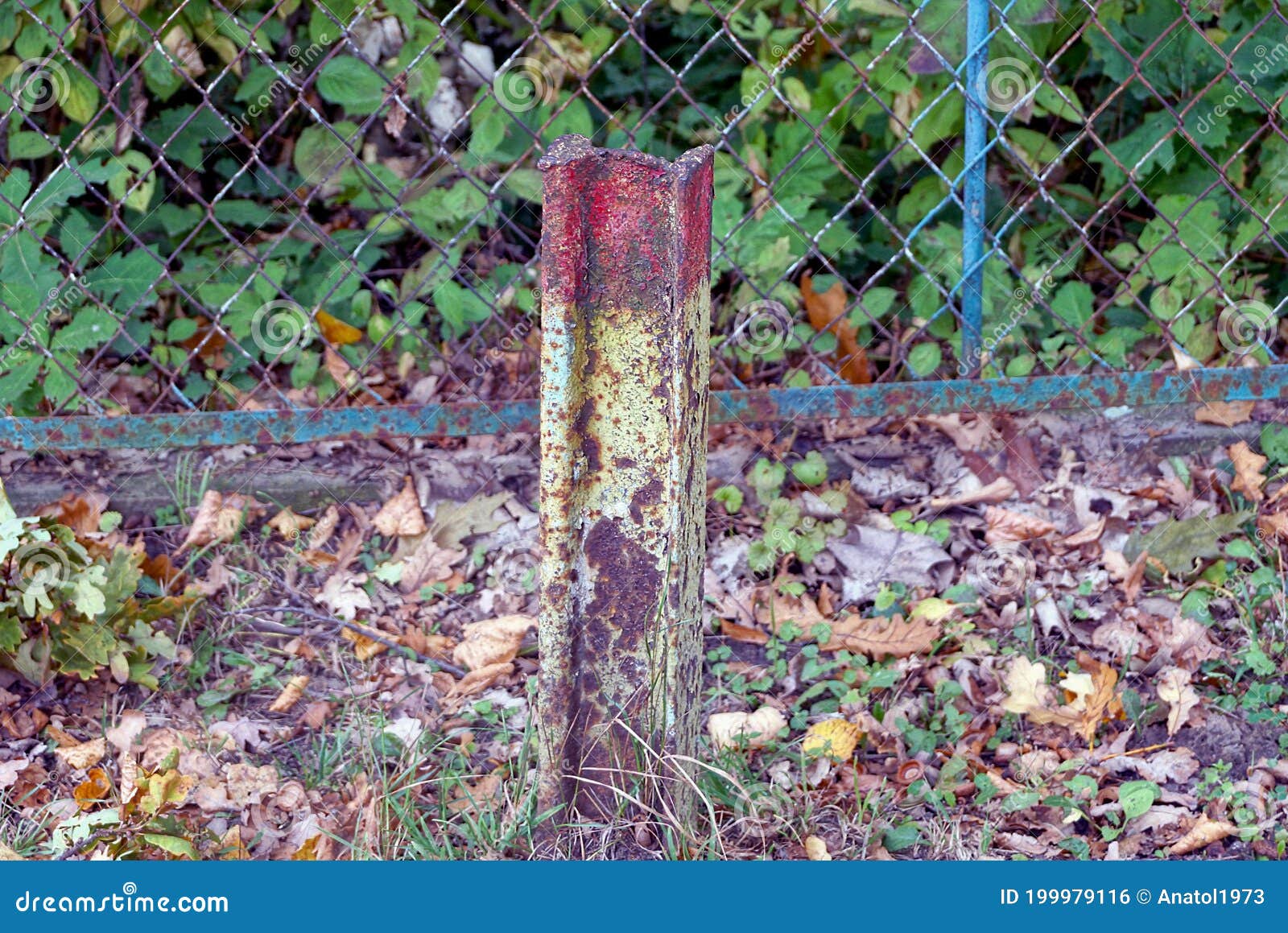 One Old Colored Iron Boundary Post Covered with Brown Rust Stock Photo ...