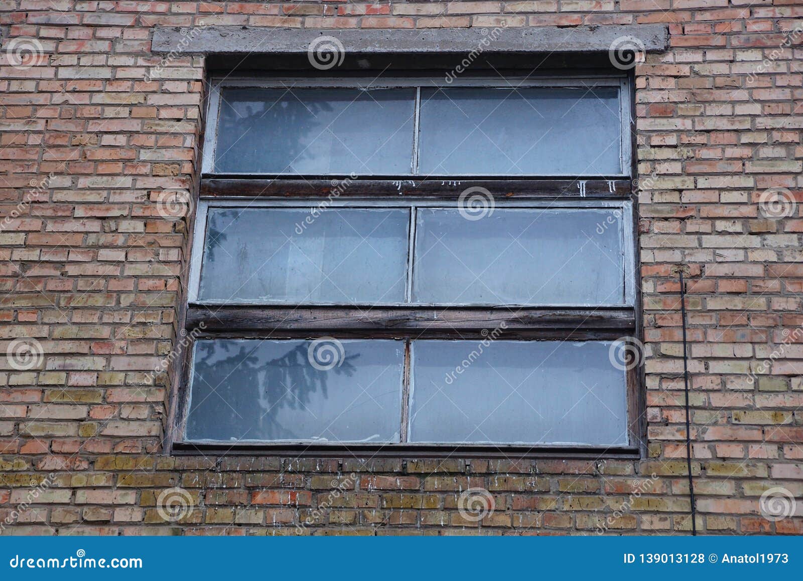 One Old Gray Window on a Brown Brick Wall of a Building Stock Photo ...