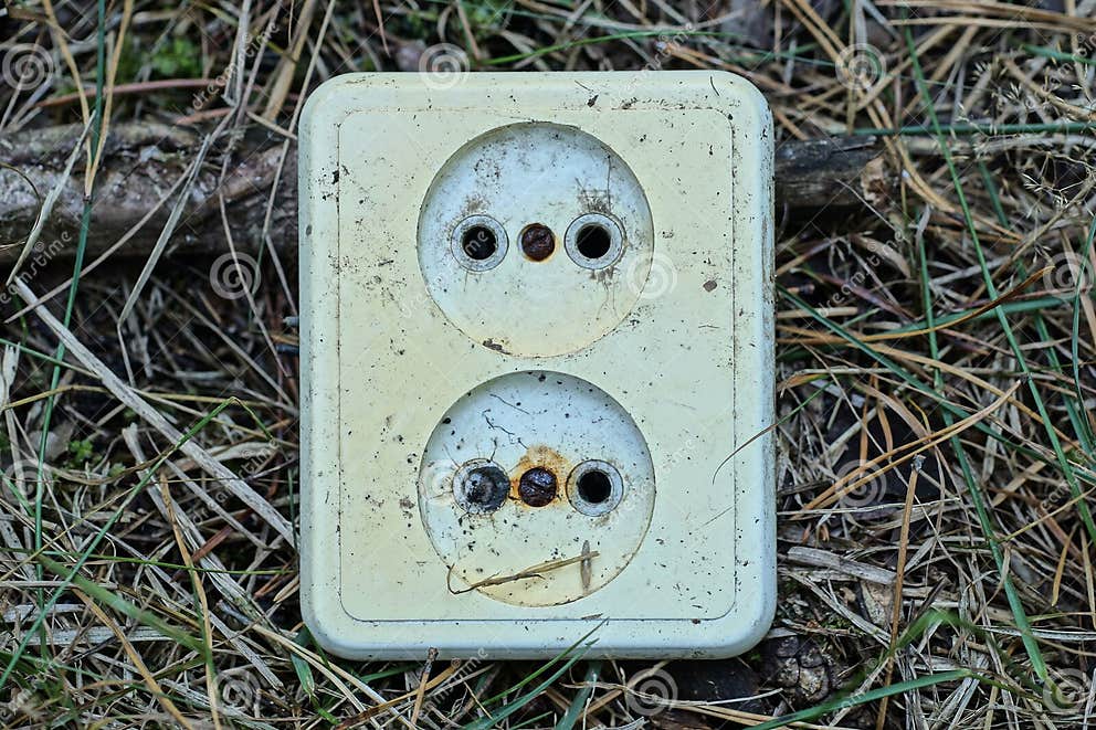 One Old Rectangular White Dirty Plastic Socket Lies on the Grass Stock ...