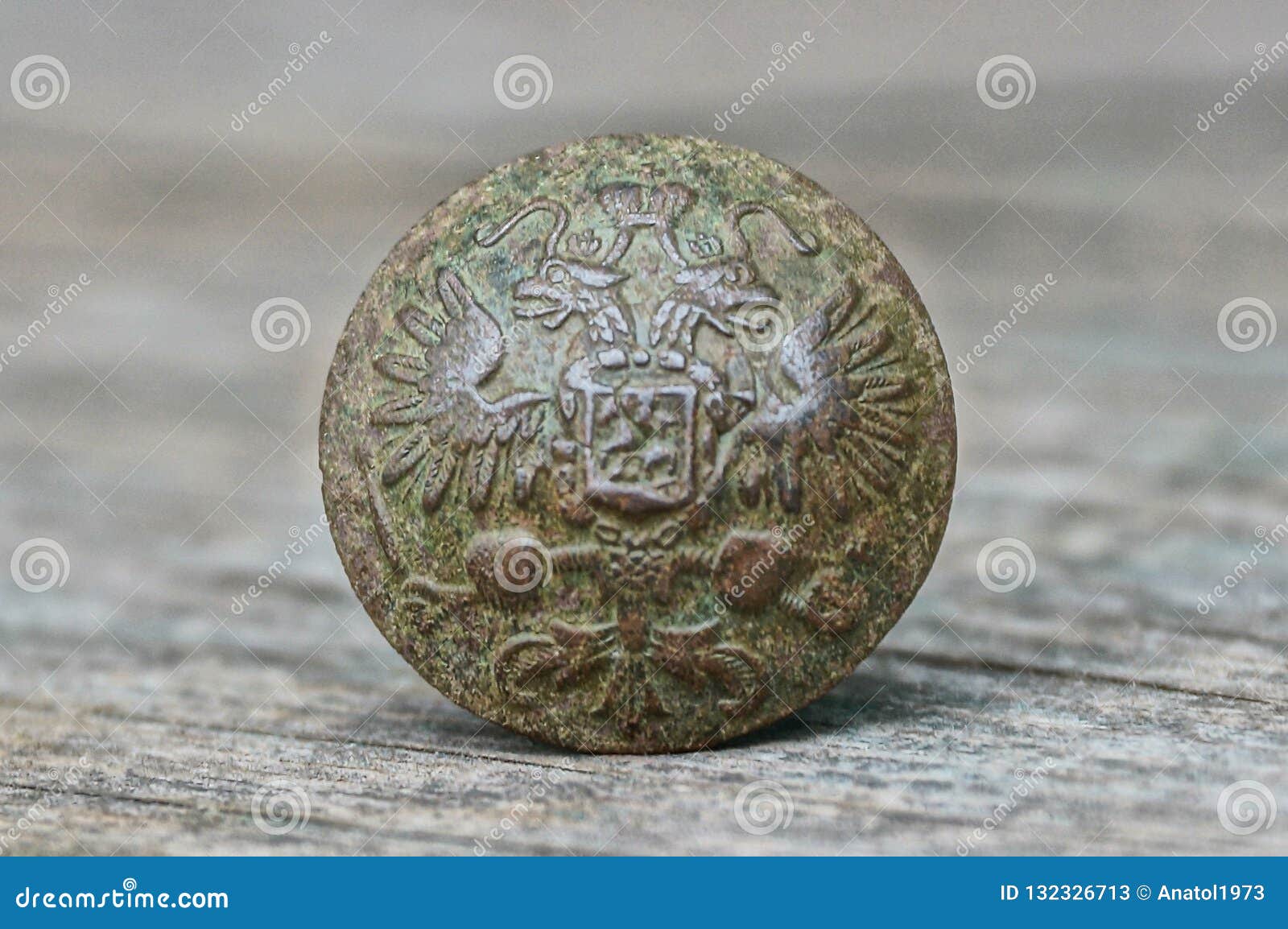 One Old Brass Button with Emblem and Eagle on a Gray Table Stock Image ...