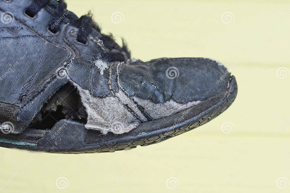 One Old Torn Black Leather Boot with a Hole Stock Photo - Image of ...