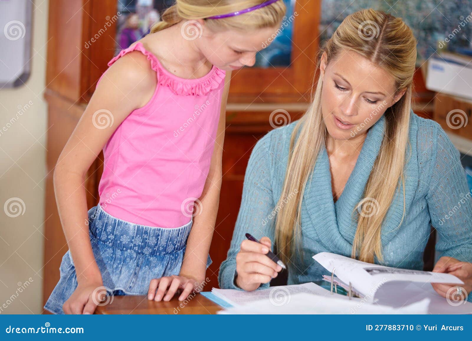 One on One Learning. a Young Teacher Explaining Work To a Student in ...