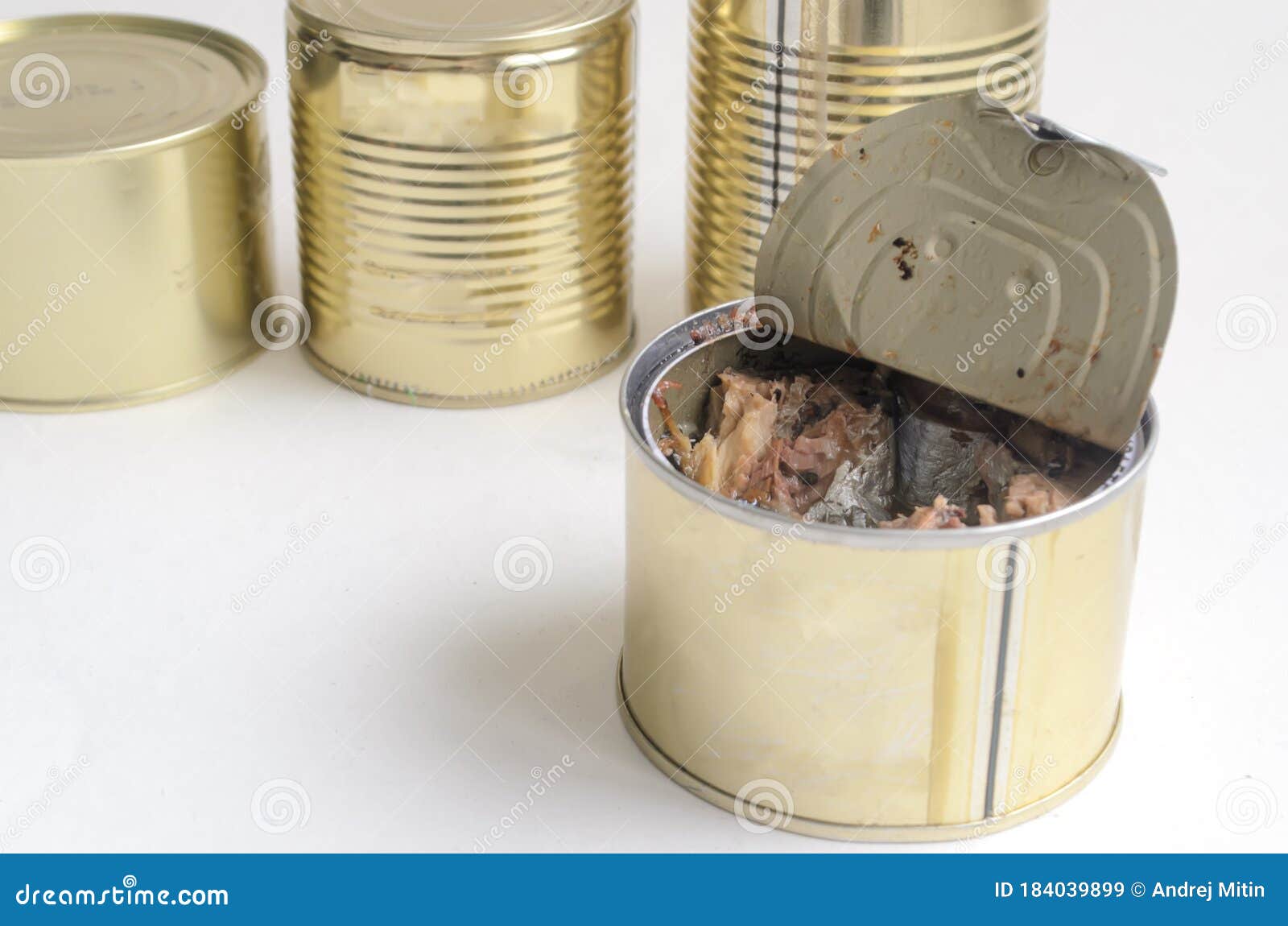 One Open Fish Can on a Background of Cans of Canned Food on a White ...