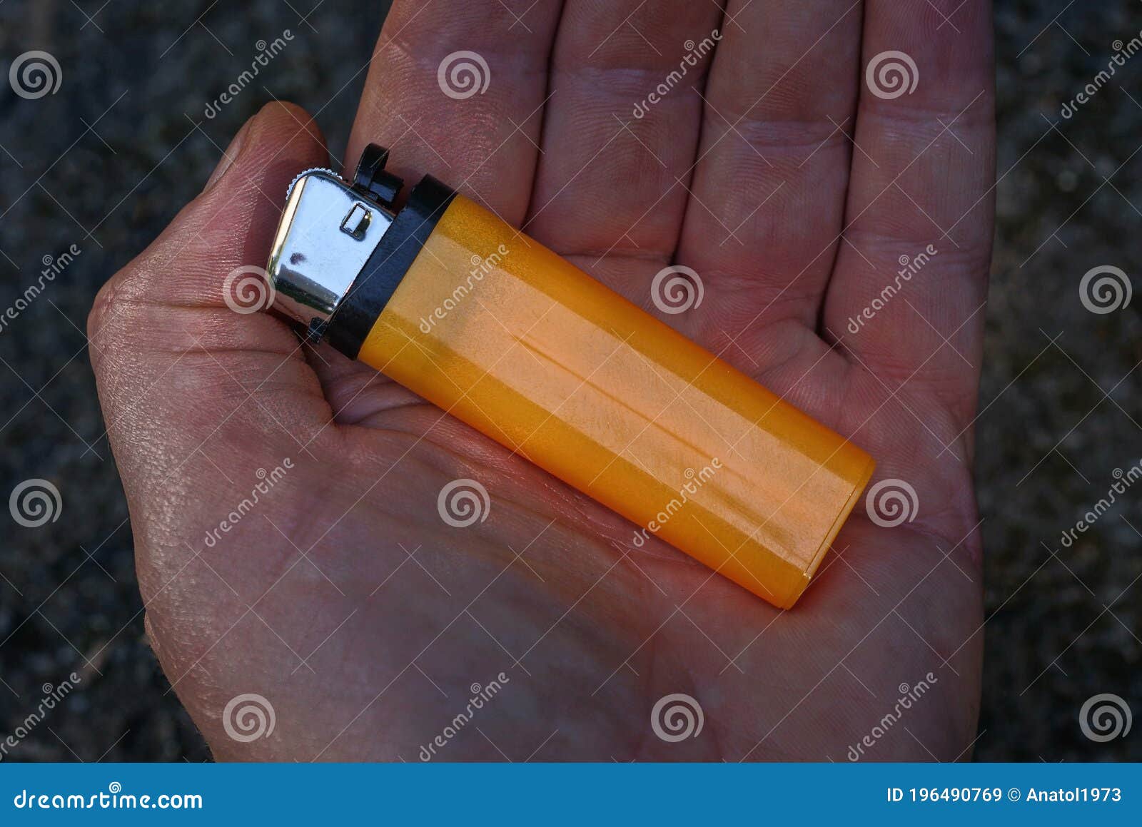 One Orange Plastic Lighter Rests on Open Palm Stock Image - Image of ...