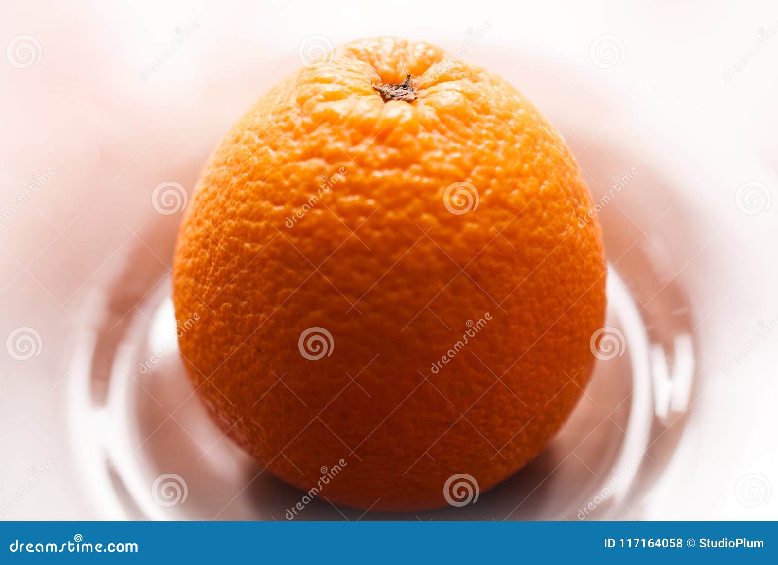 One orange on a plate stock photo. Image of orange, citron - 117164058