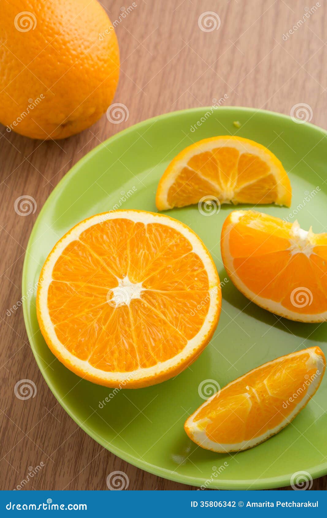 One Orange and Slices of Orange on Plate Stock Photo - Image of ...