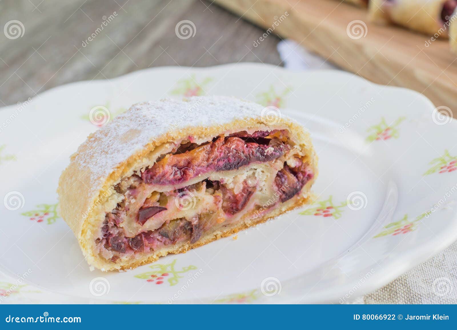 One Piece Plum Strudel on White Plate Stock Photo - Image of nuts ...