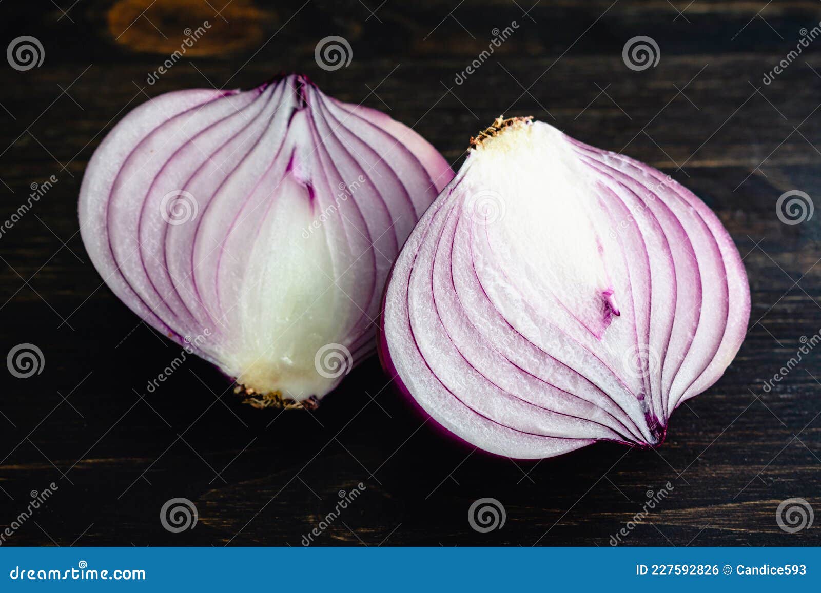Peeled and Halved Red Onion on a Dark Wood Table Stock Photo - Image of ...