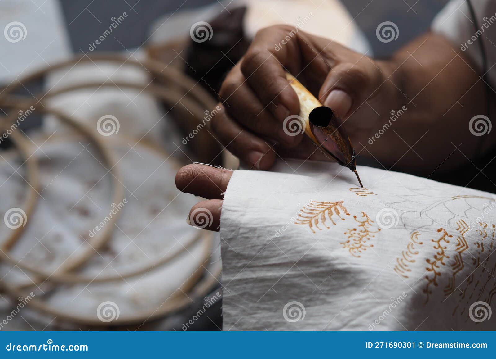 A Man is Drawing a Batik Pattern on Fabric Stock Image - Image of ...