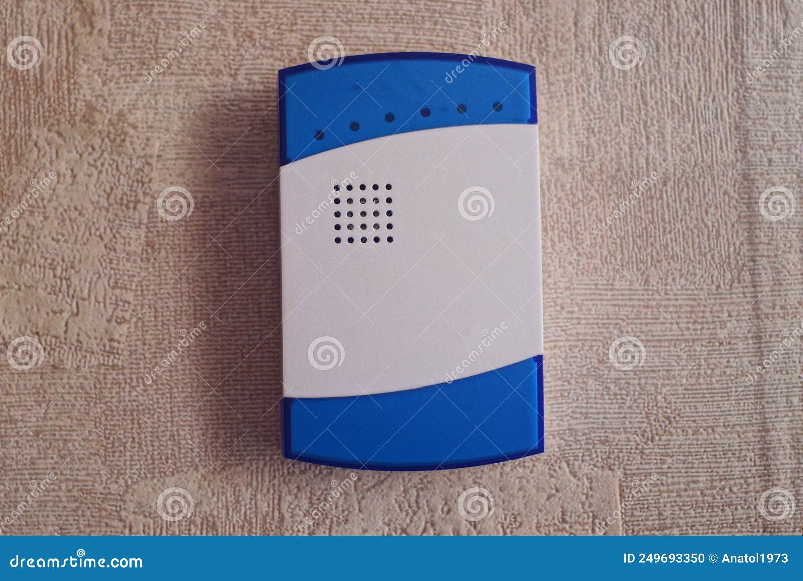 One Rectangular Plastic White Blue Bell Box Hanging on a Brown Wall ...