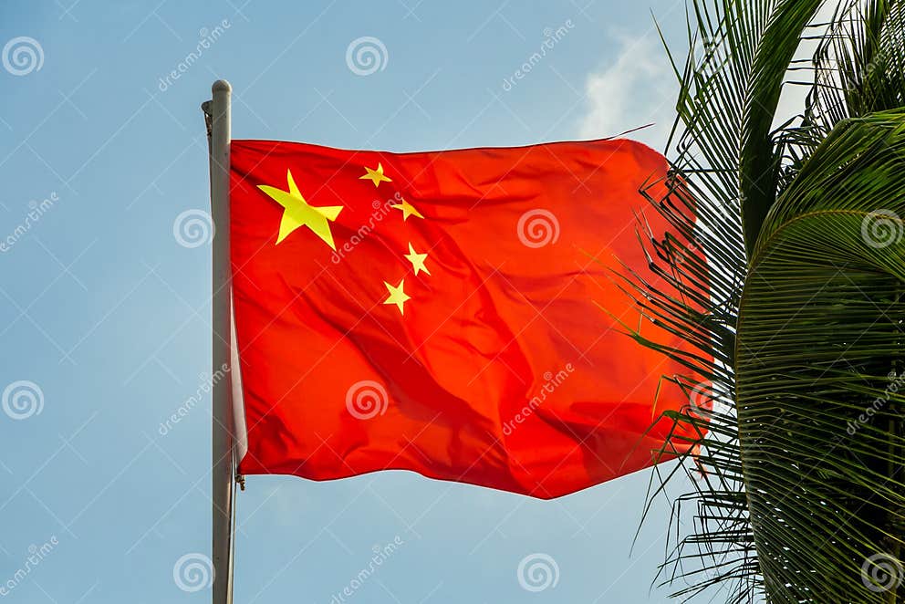 One Rectangular Red Colored Flag with Yellow Stars is on a Blue Sky ...