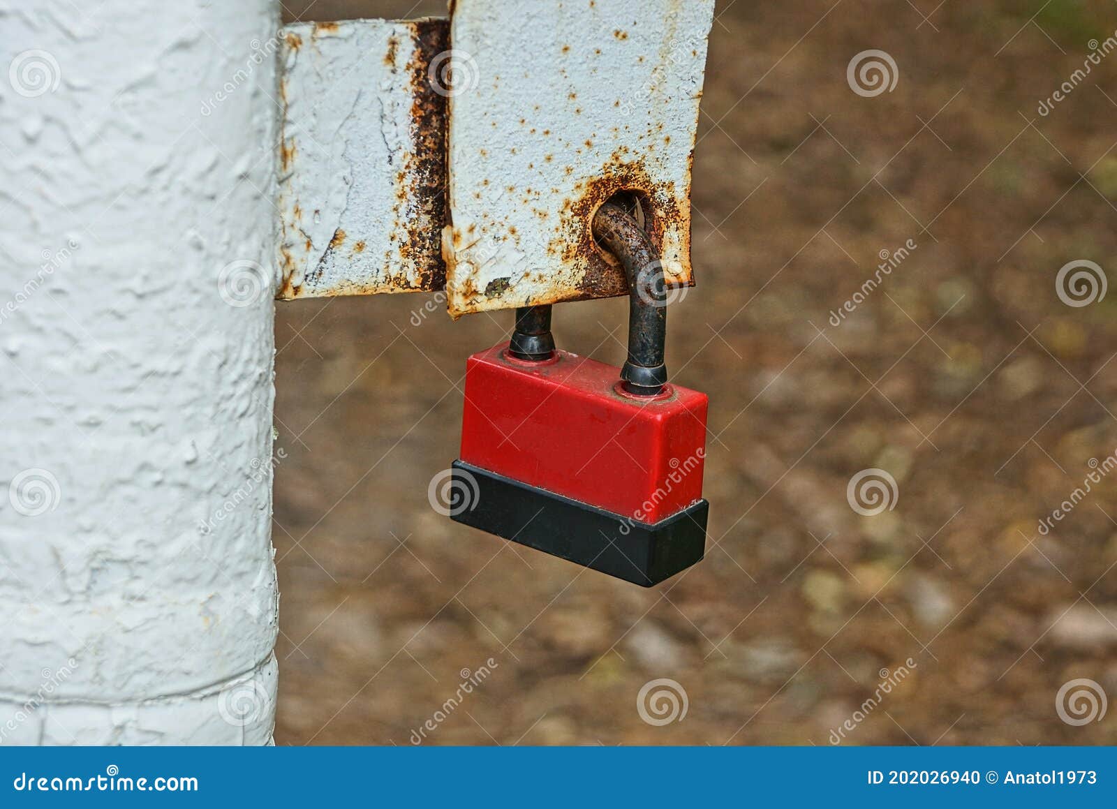 One Red Black Padlock Hanging on a White Iron Pillar Stock Photo ...
