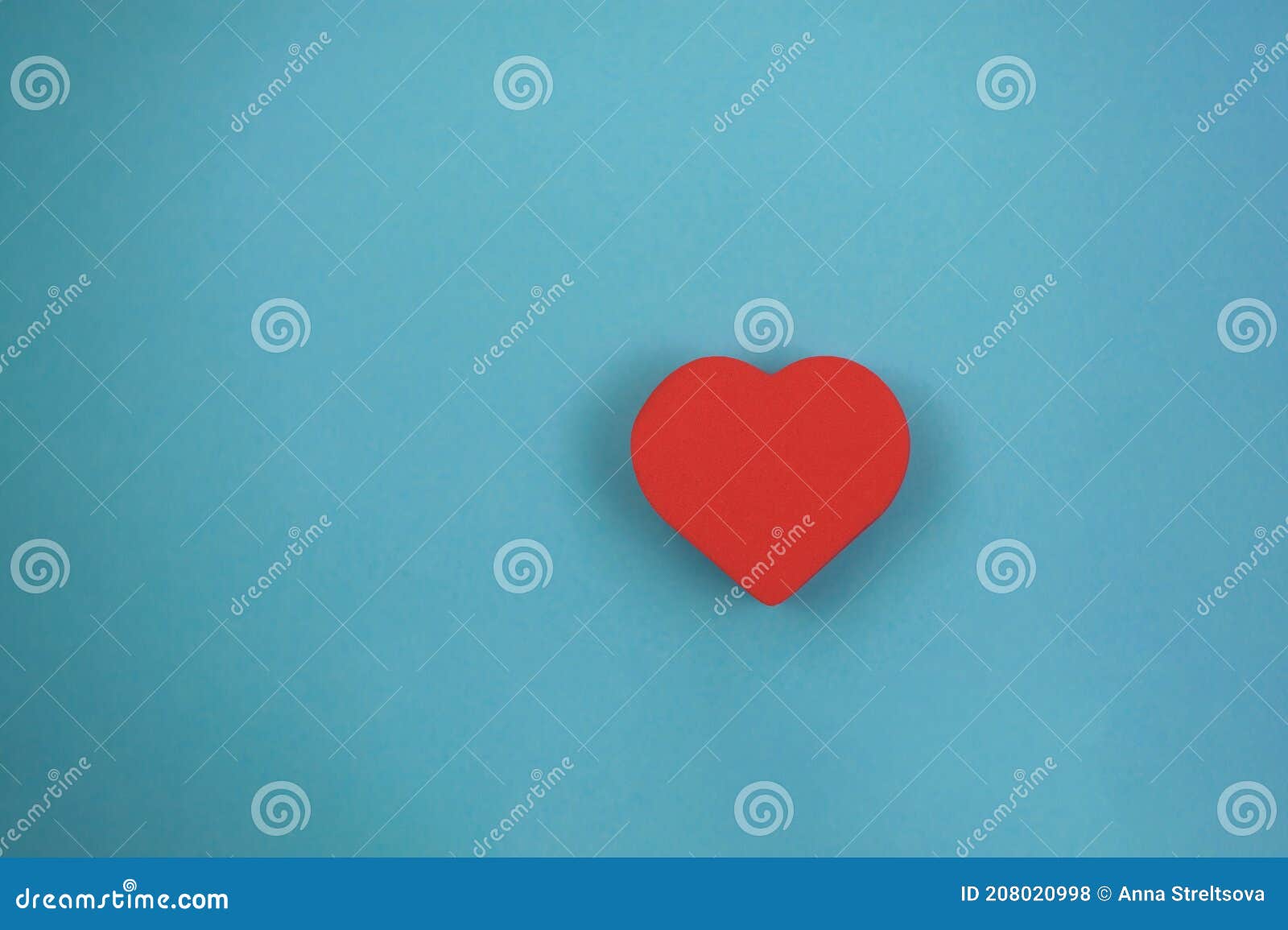 One Red Heart on a Blue Background Stock Photo - Image of holiday ...