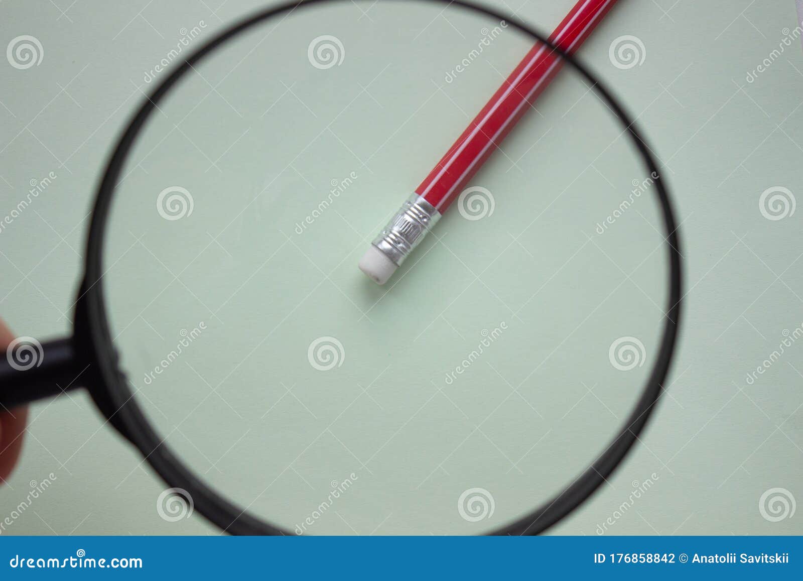 One Red Pencil Under a Magnifying Glass Close-up on a Light Background ...
