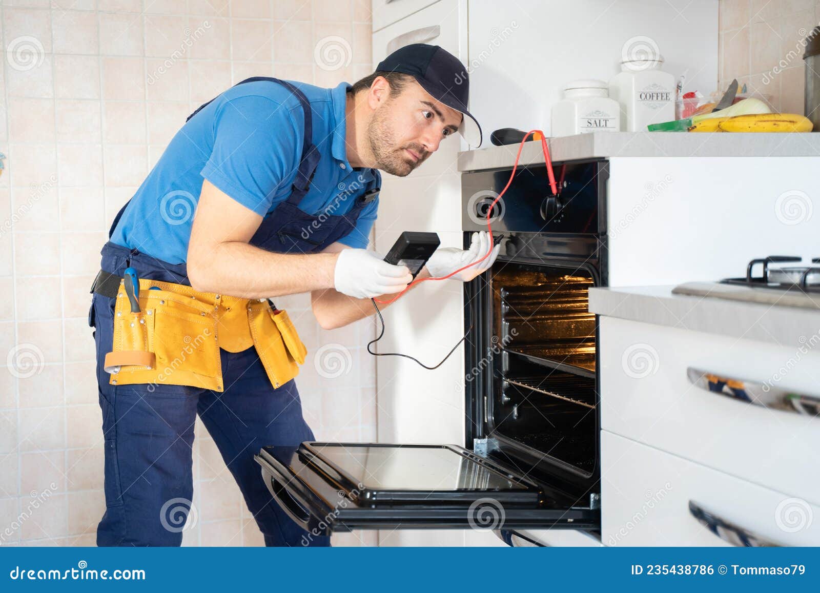 One Repairman Fixing Malfunctioning Kitchen Oven Problem Stock Photo ...