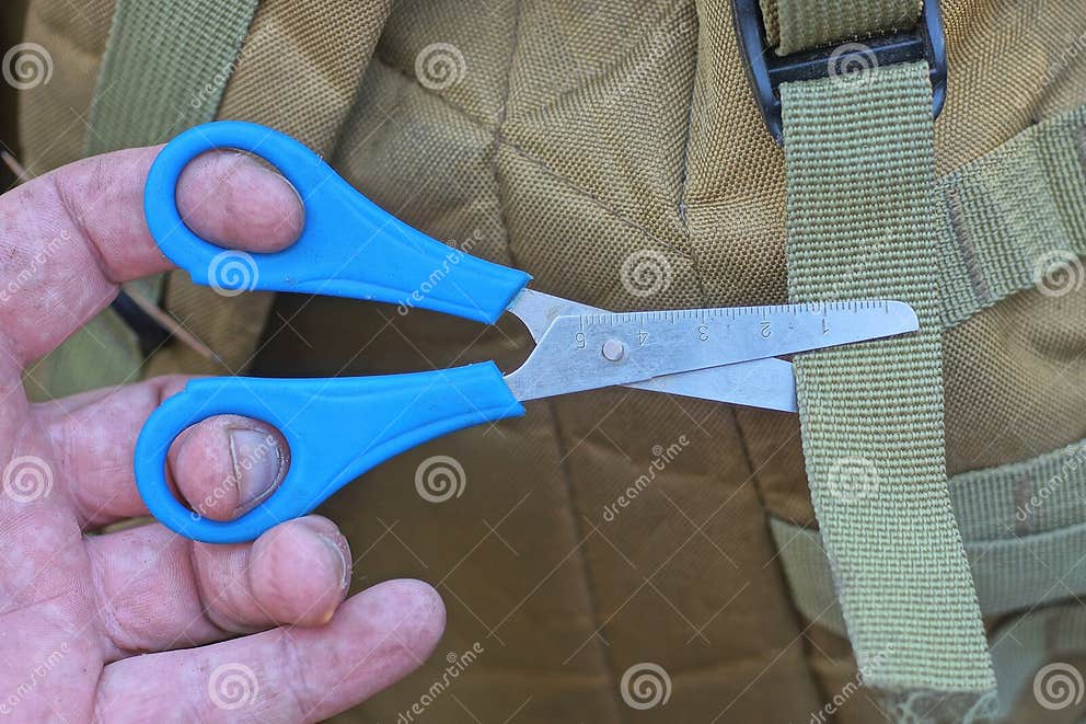 One Scissors in Hand Cuts Brown Fabric Strap Stock Photo - Image of ...