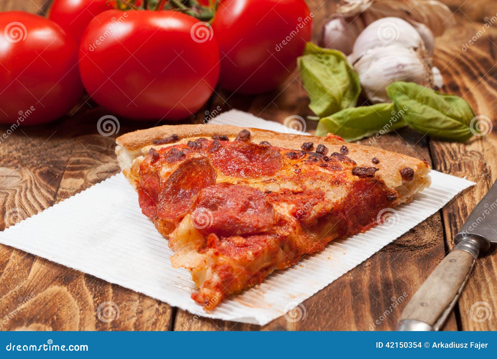 One slice of pizza. stock photo. Image of garlic, knife - 42150354