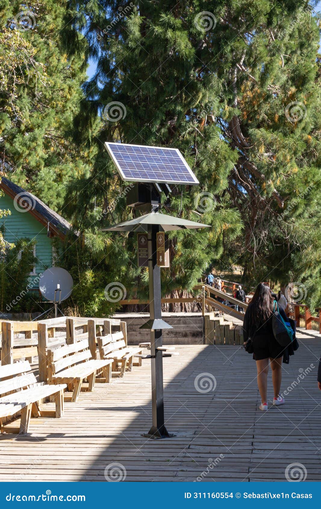 One Solar Panel in a Pole Near a Modern House in the Middle of a Forest ...