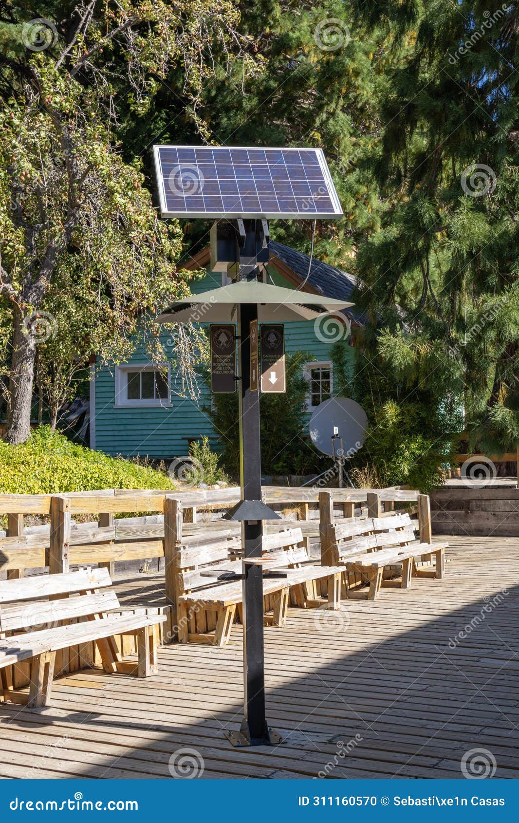 One Solar Panel in a Pole Near a Modern House in the Middle of a Forest ...