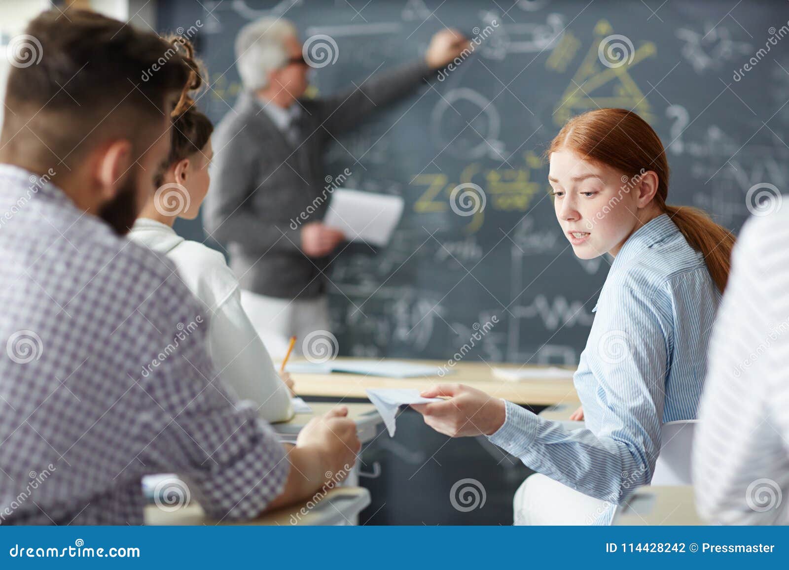 Passing note stock photo. Image of girl, teenager, lesson - 114428242