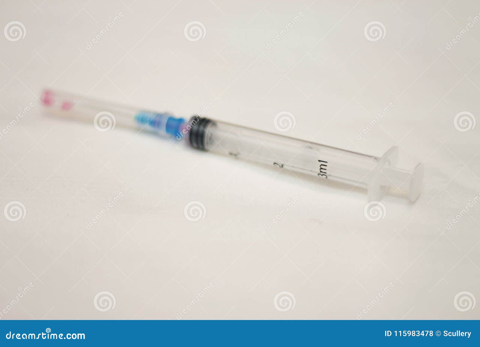 One Syringe with Cap and Needle after Using on the White Stock Photo ...